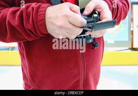 Series of photos showing the loading of a 35mm film into a Nikon Single ...