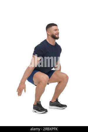 Man doing squats on white background. Morning exercise Stock Photo - Alamy