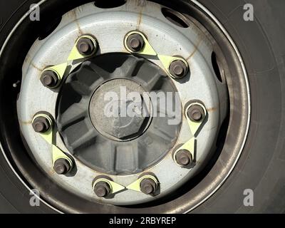 Truck wheel and tire and nuts indicators shows defects in tension nut ...