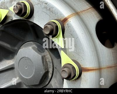 Truck wheel and tire and nuts indicators shows no defects in tension ...