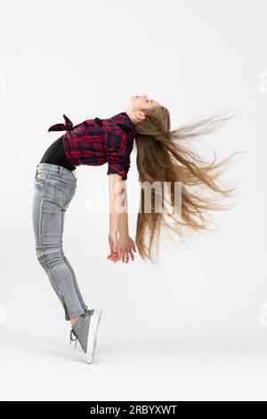 Young girl throws back her long hair in the air Stock Photo - Alamy