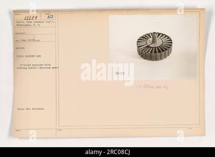 A Lewis machine gun with a 97-round magazine, magazine gauge, and ...