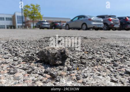 Small rock on road - rough texture close up background. Taken in ...