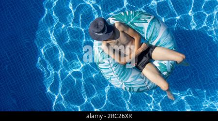 Swim ring with wave pattern in the empty clear pool. Swimming pool top ...