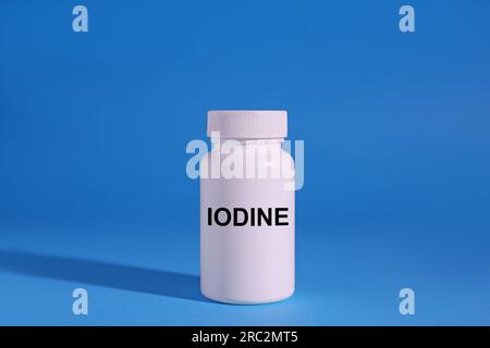 Plastic container of medical iodine on black background, color tone ...