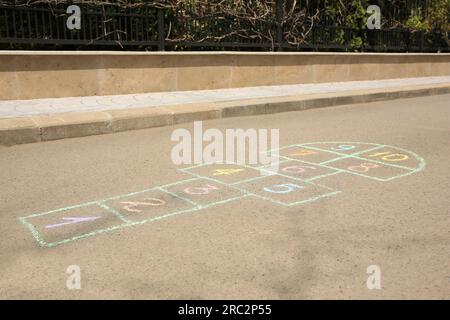 Hopscotch drawn with colorful chalk on asphalt outdoors Stock Photo - Alamy