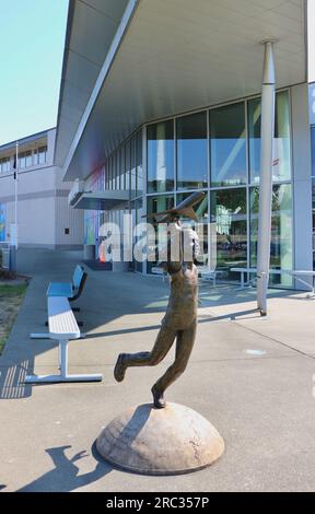 Bronze statue of a child with a Boeing 747 Jumbo Jet standing on the ...