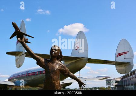 Bronze statue of a child with a Boeing 747 Jumbo Jet standing on the ...