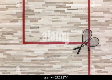 Squash Rackets And a Ball on a Wooden Court Floor. Sport Theme Stock ...