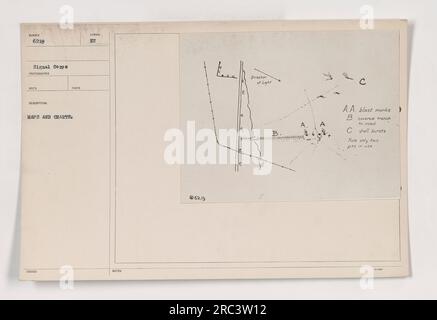 An American soldier studying maps and charts of Region de Laon during ...