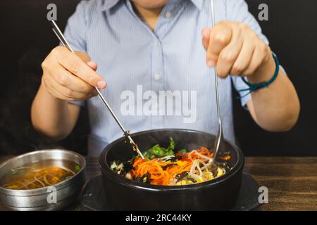 When you eat bibimbap, mix it well first. Then it's normal to start ...
