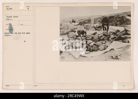 This historical photograph depicts the distribution of bread at a ...