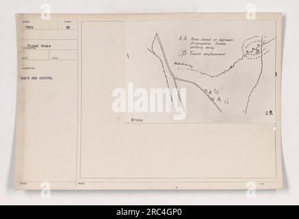 An American soldier studying maps and charts of Region de Laon during ...