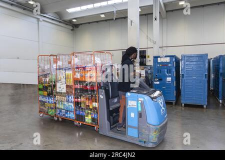worker on the forklift that loads and distributes the food for the ...