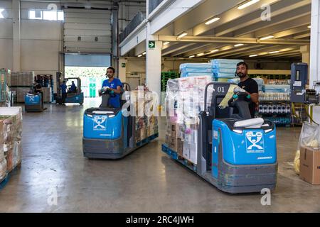 worker on the forklift that loads and distributes the food for the ...