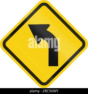 Colombian road warning sign: Left curve ahead Stock Photo - Alamy
