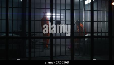 Two guilty inmates in detention center or correctional facility ...