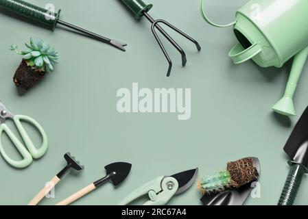 Frame made of different gardening tools and plant on beige background ...