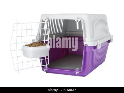 Violet pet carrier with bowl of dry food isolated on white Stock Photo ...