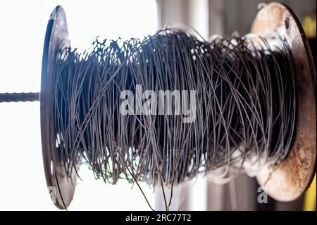 Silhouette spool of thick wire on a spindle Stock Photo - Alamy