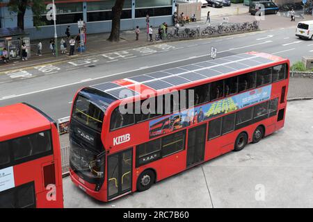 Kowloon Motor Bus (KMB) bus stop and monthly pass advertisement, Lai ...