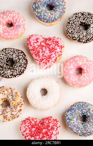 Donuts glazed with various sprinkles Stock Photo - Alamy