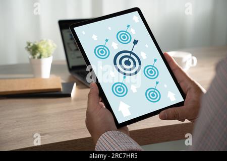 Businessman set up objectives and target goals for success plan ...