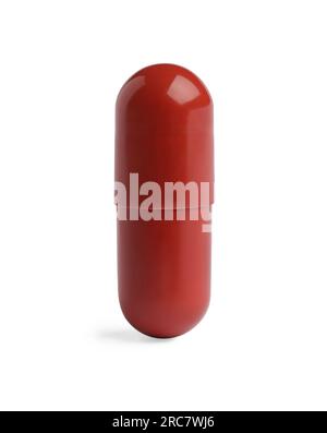One red pill on white background. Medicinal treatment Stock Photo - Alamy