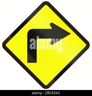Indonesian road warning sign: Right curve ahead Stock Photo - Alamy