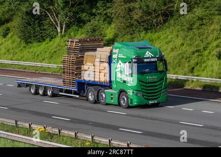A lorry carrying timber products on the M40 motorway, Warwickshire, UK ...
