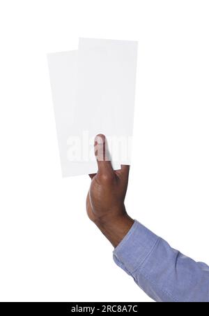 African American man holding flyers on white background, closeup ...