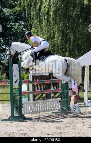 riders jump contest in germany Stock Photo - Alamy