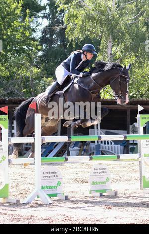 riders jump contest in germany Stock Photo - Alamy