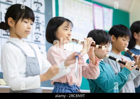 Elementary school students practicing the recorder Stock Photo - Alamy