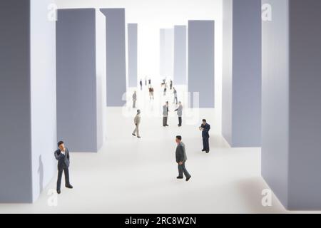 Buildings and miniature office workers Stock Photo - Alamy