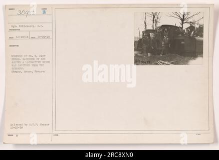 Members of Co. E, 21st Engineers, gathered around a captured German ...