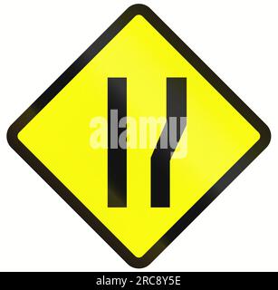 Indonesian road warning sign: Road widens on both sides Stock Photo - Alamy