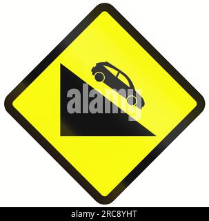 Indonesian road warning sign - Downhill grade Stock Photo - Alamy