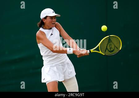 Ena Koike in action against Alina Korneeva in their Girl's Singles ...