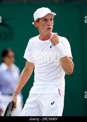 Henry Searle celebrates a point against Yaroslav Demin during the Boys ...