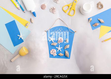Paper bucket of shells summer idea for kids craft in kindergarten hands ...