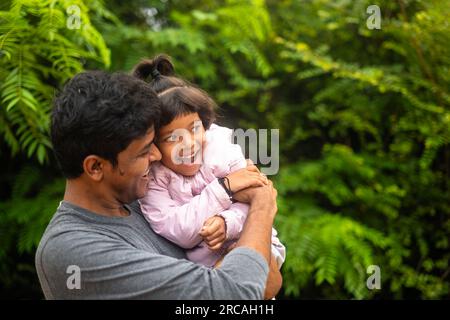 A heartwarming photo of an Indian father and daughter smiling and ...