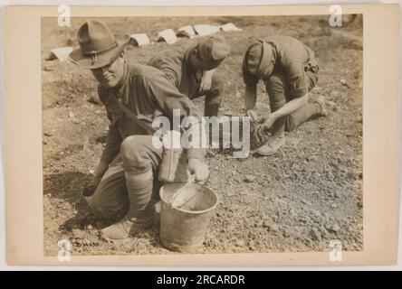 American soldiers preparing artillery shells during World War I. The ...