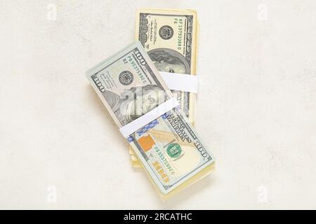 Bundles of dollar banknotes on light grey background Stock Photo - Alamy