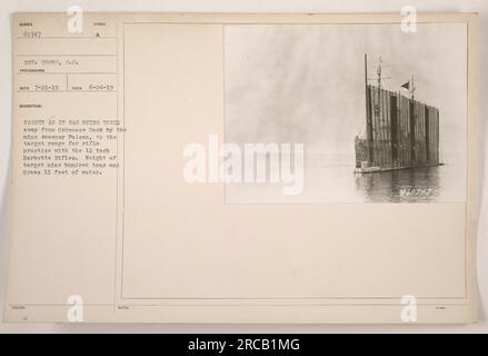 A target being towed away from Ordnance Dock by the mine sweeper Falcon ...