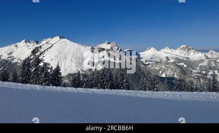 Snow covered mountains near Gstaad, Swiss Alps. View from Mt Wispile ...