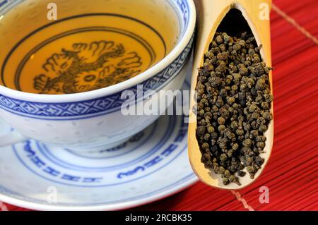 Cup of tea with medicinal Evodia fruit (Evodiae Fructus Stock Photo - Alamy
