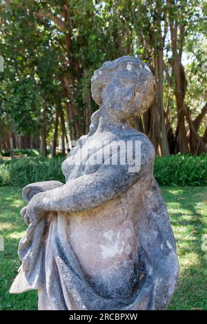 Erosion of a female stone statue in a garden at the John and Mable ...