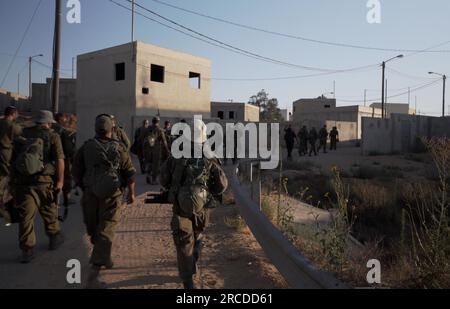 Israeli combat soldiers stand together in a simulated residential ...