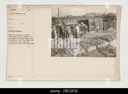 Soldiers take cover in a trench from enemy fire during a night attack ...